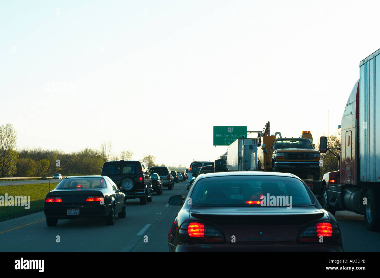 Cars and trucks stopped in a traffic jam on a United States interstate ...
