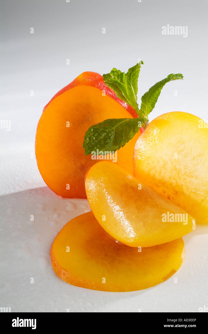 Sliced plum over white background Stock Photo - Alamy