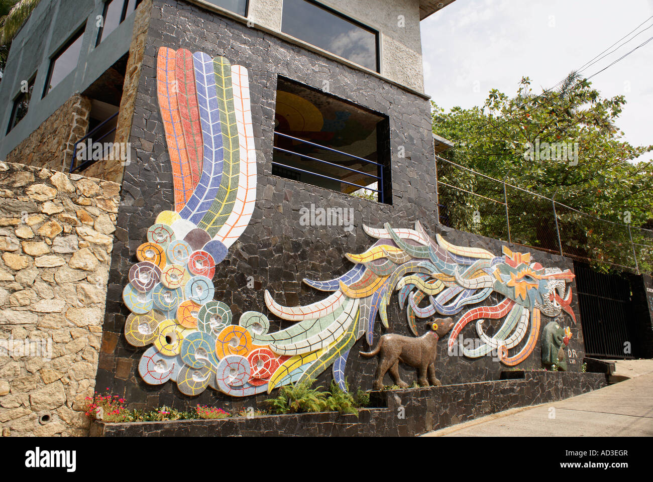 Feathered serpent mural by Diego Rivera on the front wall of the Casa ...
