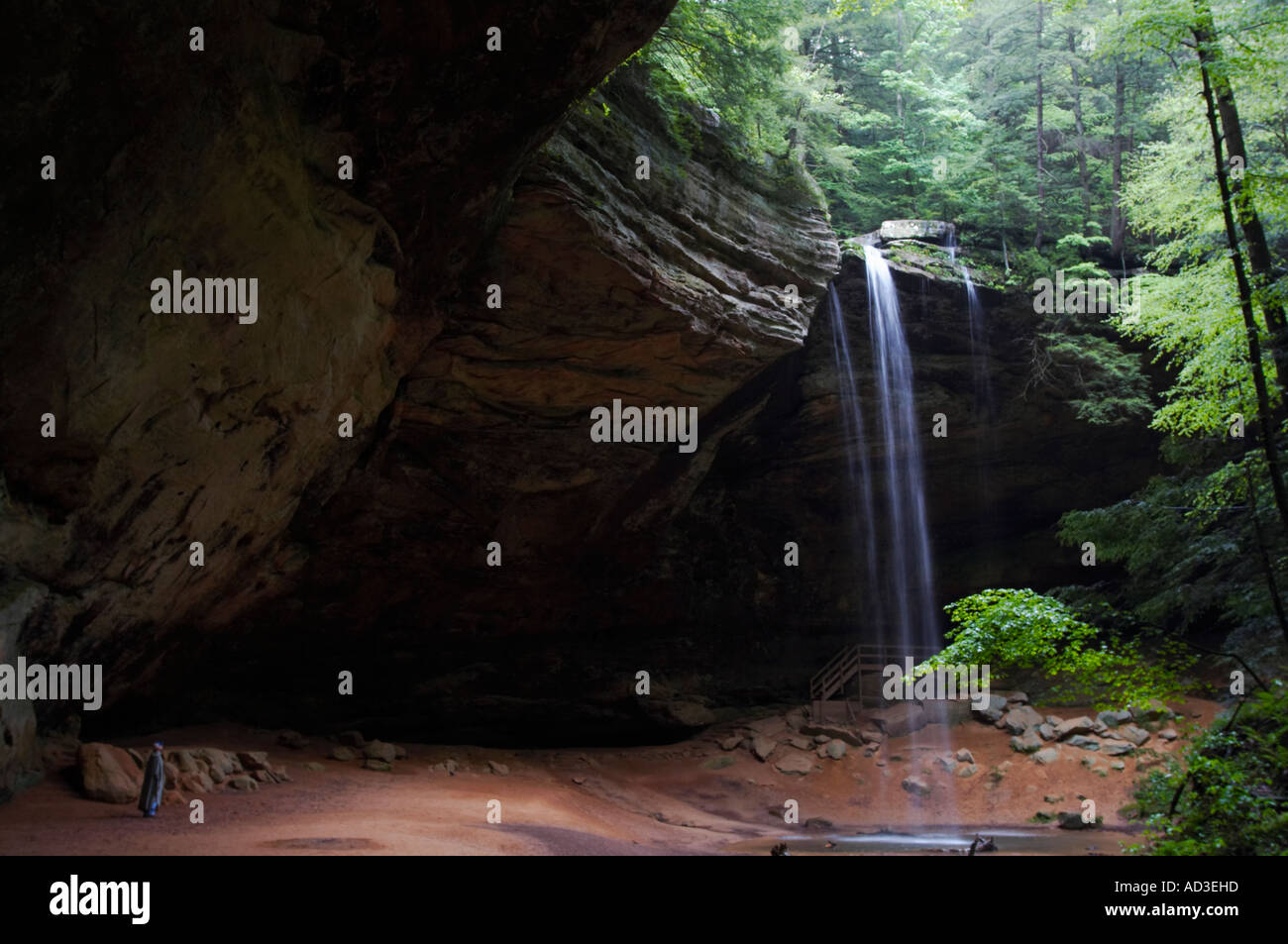 Water streams over the edge of a cliff at Ash Cave in Hocking Hills ...