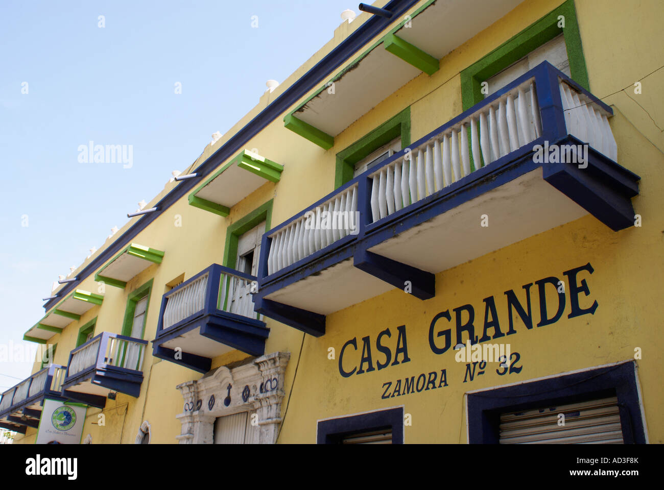 Brightly painted Spanish colonial style buildings with balconies in the ...