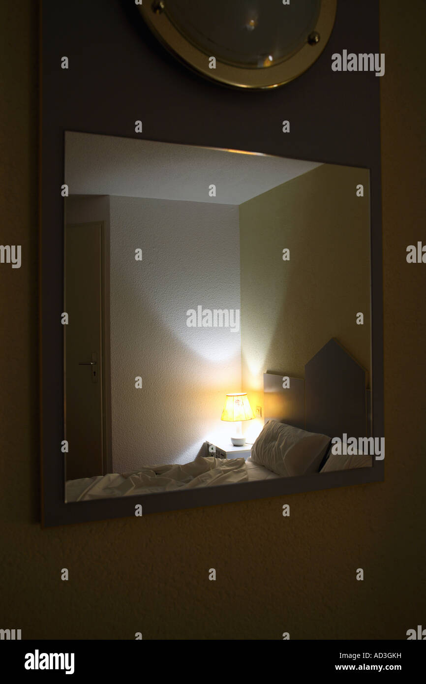 empty motel room with bed and lamp at night Stock Photo - Alamy