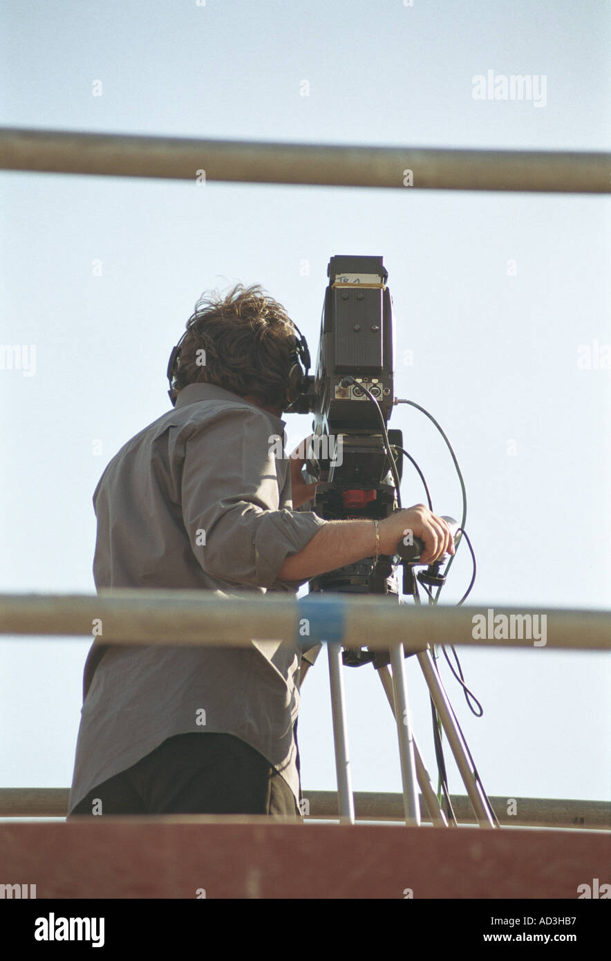 cameraman on platform filming Stock Photo - Alamy