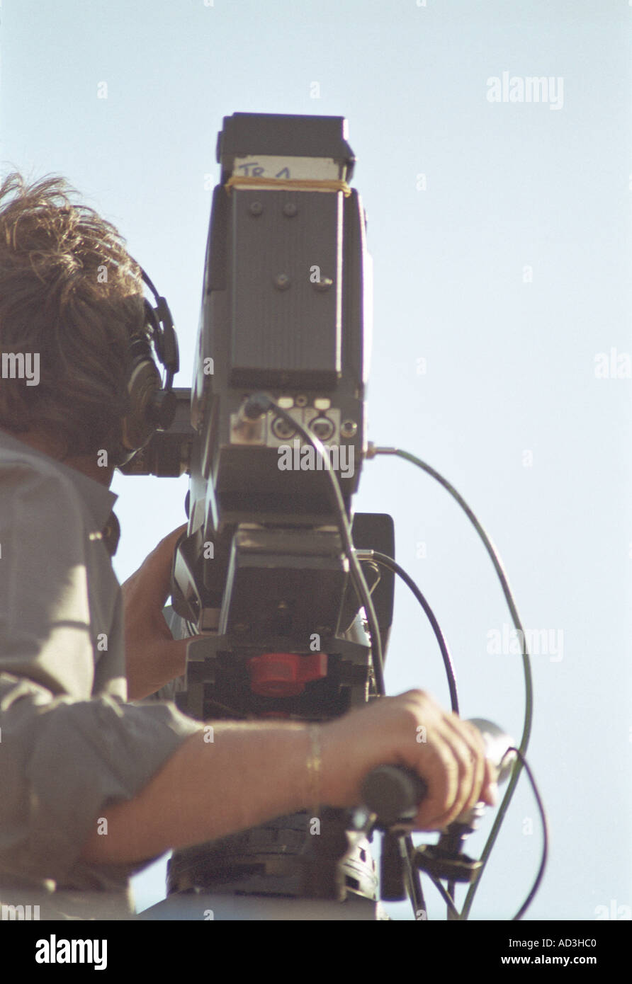 cameraman on platform filming Stock Photo - Alamy