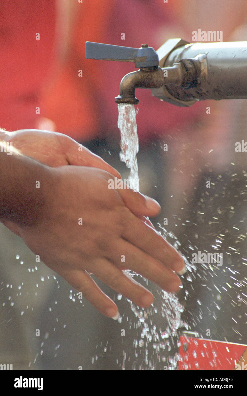washing hands under running tap water Stock Photo - Alamy