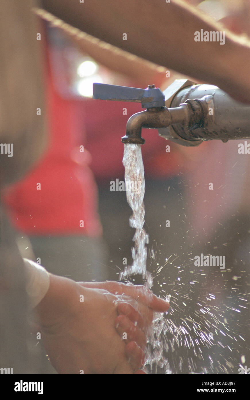 washing hands under running tap water Stock Photo - Alamy