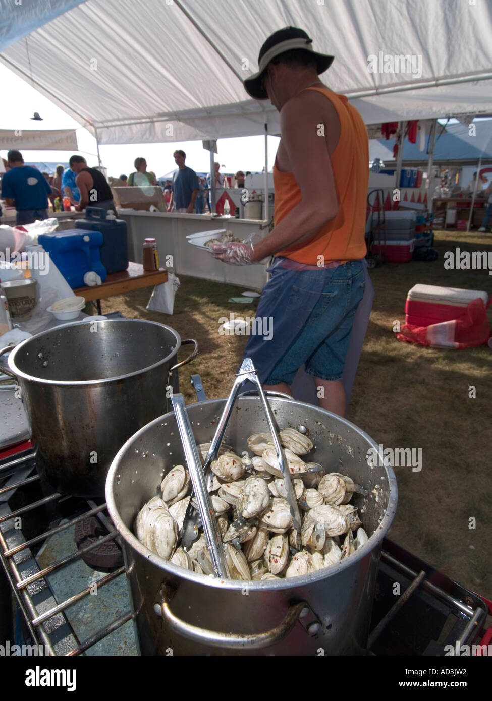 Shellfishermen shuck, clean and serve shellfish at the Seafood festival ...