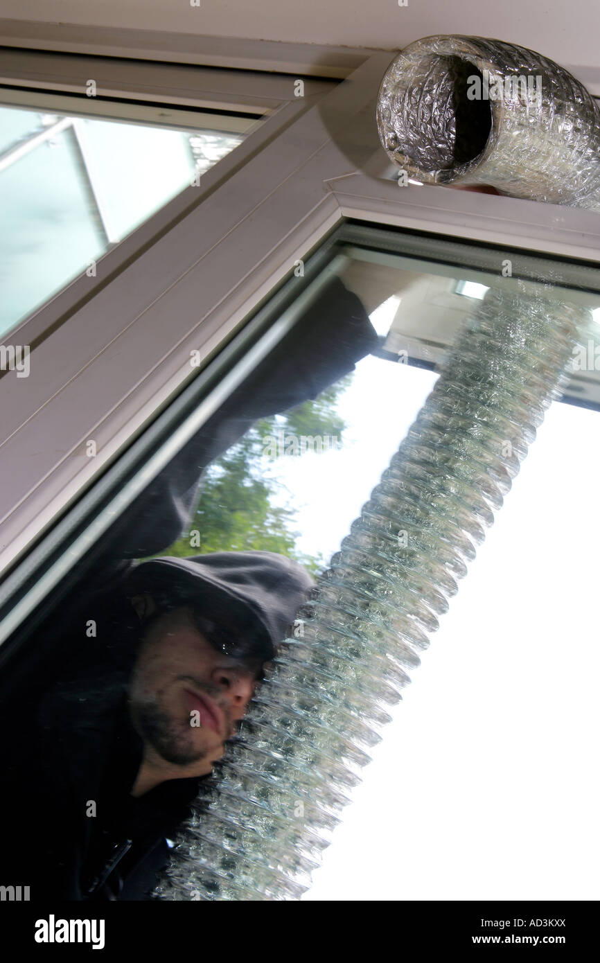 Man Placing Gas Pipe in Window Model Released Stock Photo - Alamy