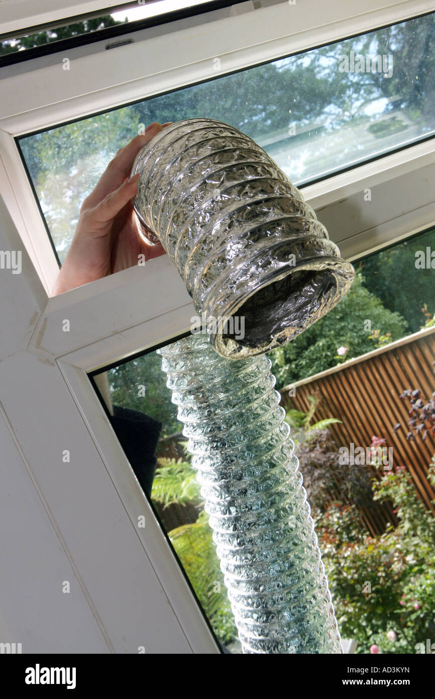 Man Placing Gas Pipe in Window Model Released Stock Photo - Alamy