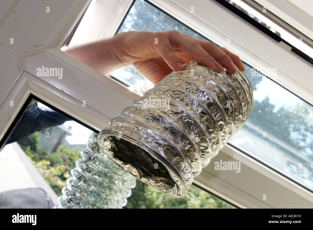 Man Placing Gas Pipe in Window Model Released Stock Photo - Alamy