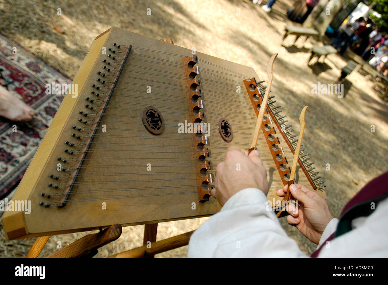 Close up of a man playing an instrument, holding 2 sticks Stock Photo ...