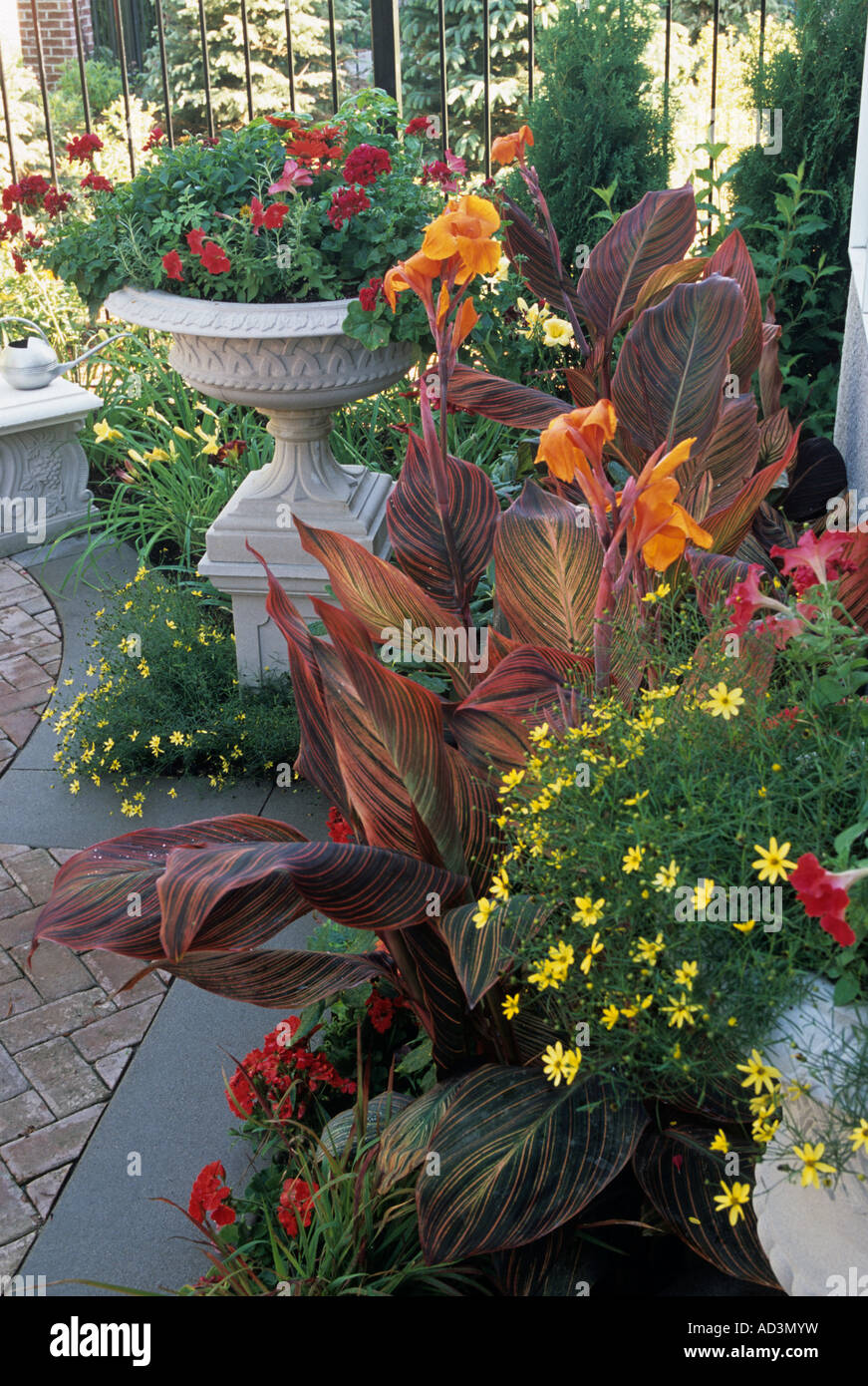 MINNESOTA TOWNHOME PATIO GARDEN WITH STONE PLINTHS AND URNS, TROPICANNA ...