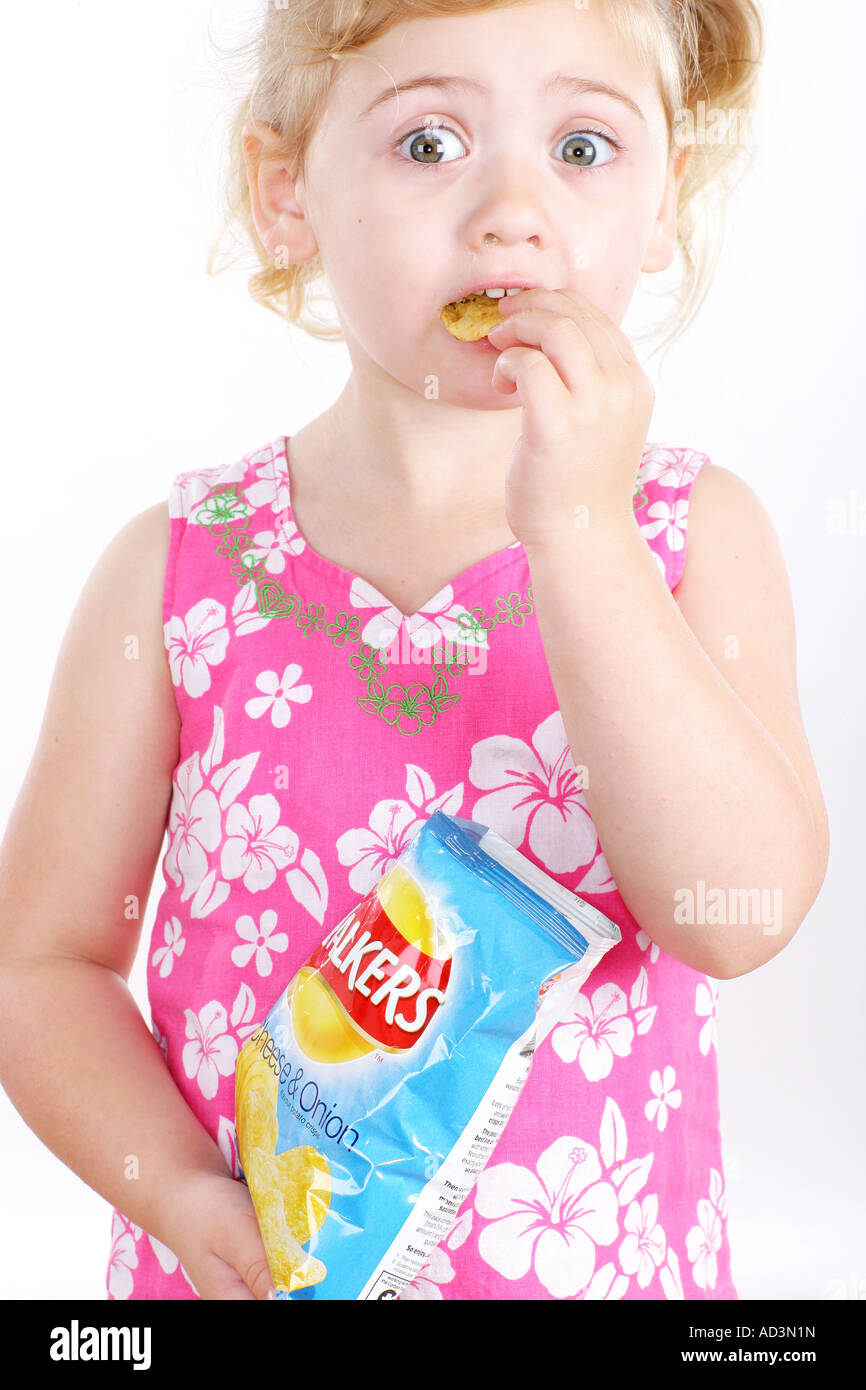 Young Girl Eating Cheese and Onion Crisps Model Released Stock Photo ...