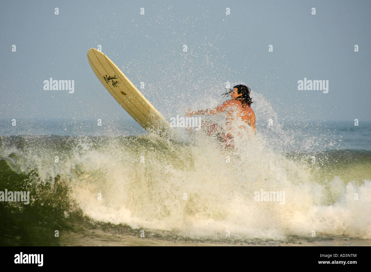A surfer riding a wave Stock Photo - Alamy