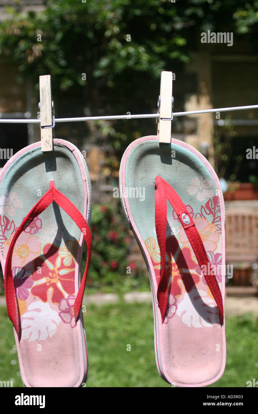 Flip flops on washing line Stock Photo - Alamy