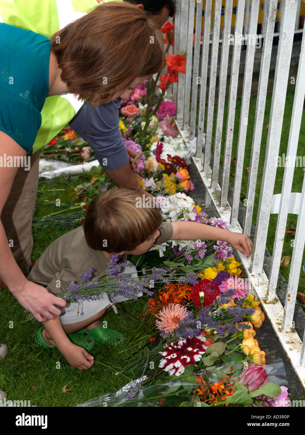 Children laying flowers hi-res stock photography and images - Alamy