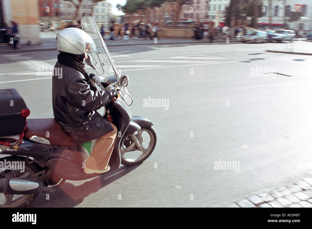 woman riding moped in winter rome Stock Photo - Alamy