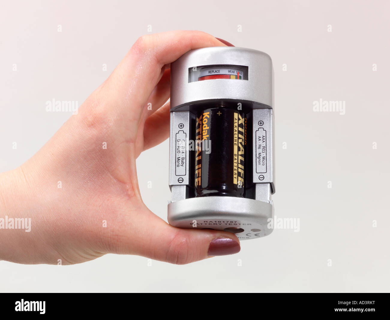 Hand Holding Battery Tester Showing Battery With Power Stock Photo - Alamy