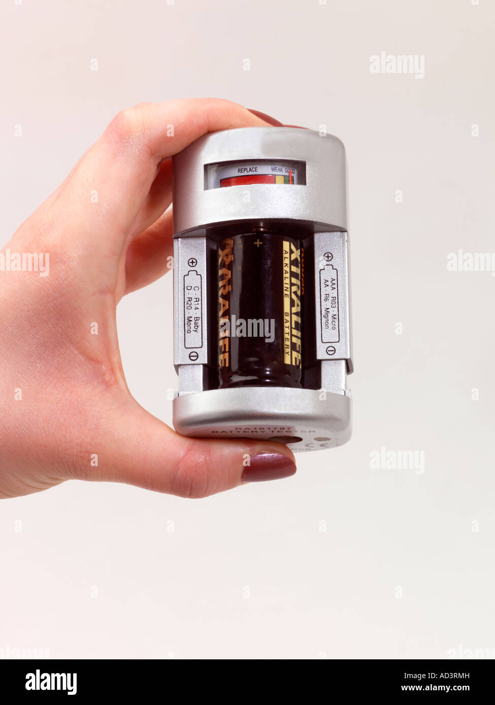 Hand Holding Battery Tester Showing Battery With Power Stock Photo - Alamy