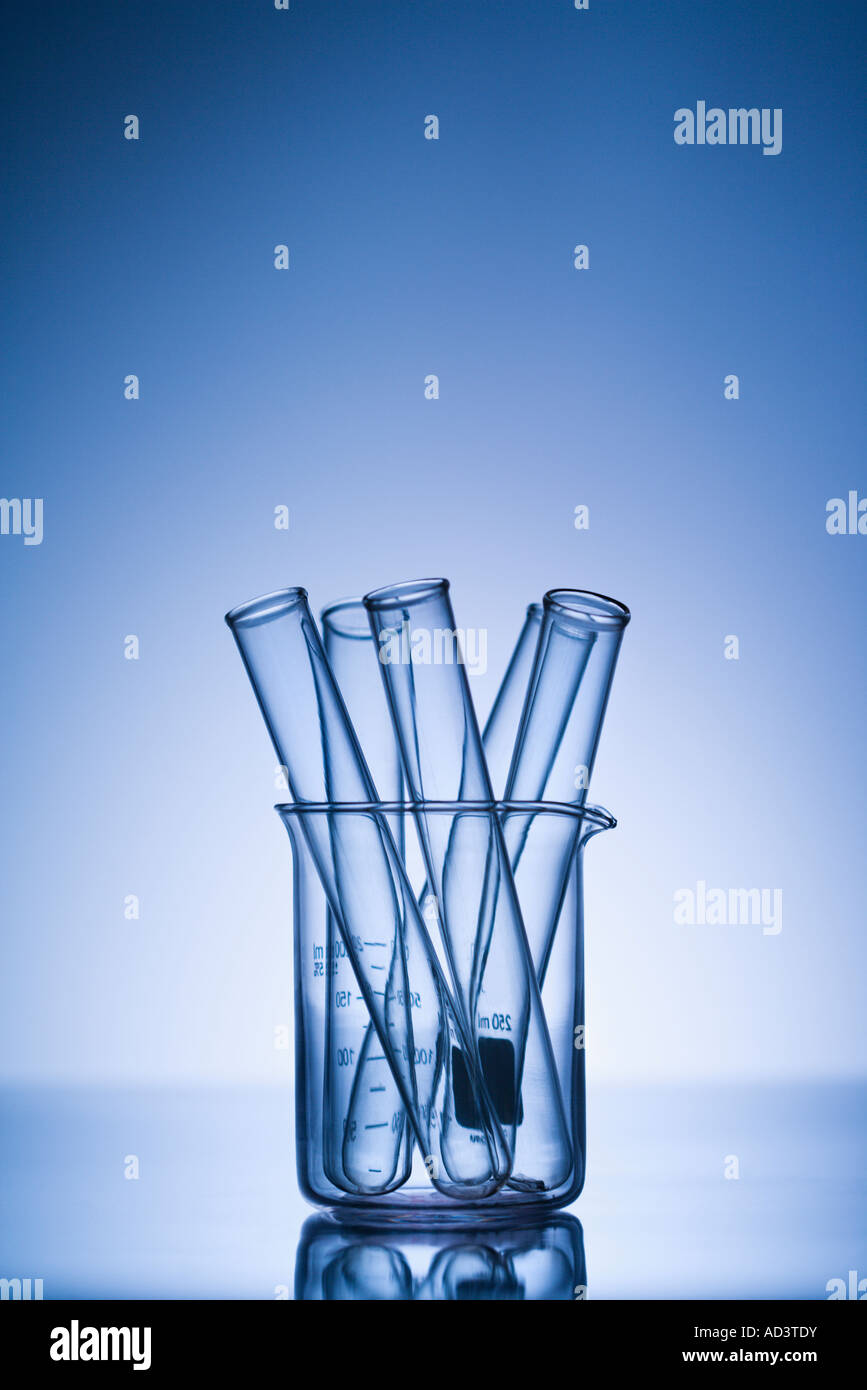 Test tubes in glass beaker with blue tint Stock Photo - Alamy