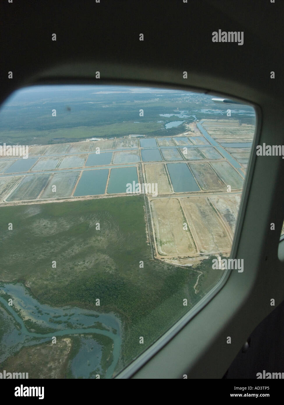 Looking out the window of a small plane to see the southern Belize ...