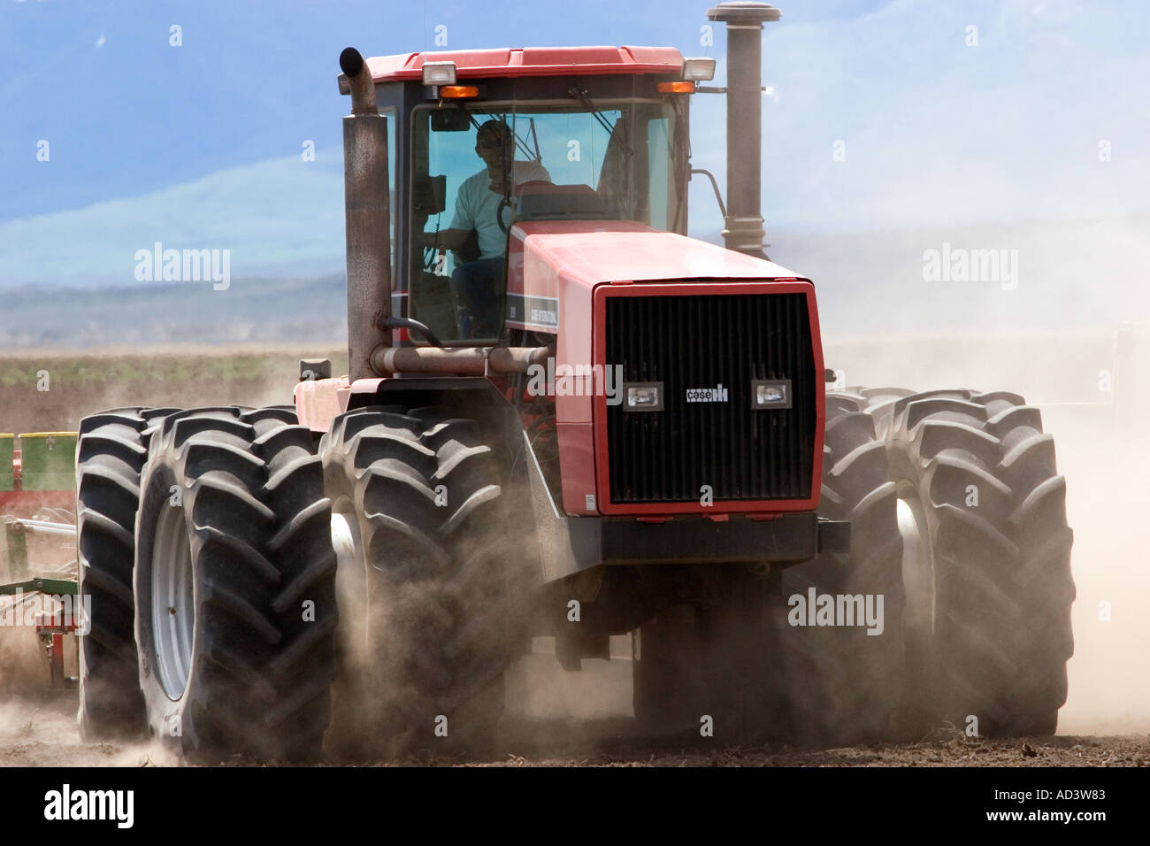 Four wheel drive tractor with dual tires planting wheat in Camas County ...