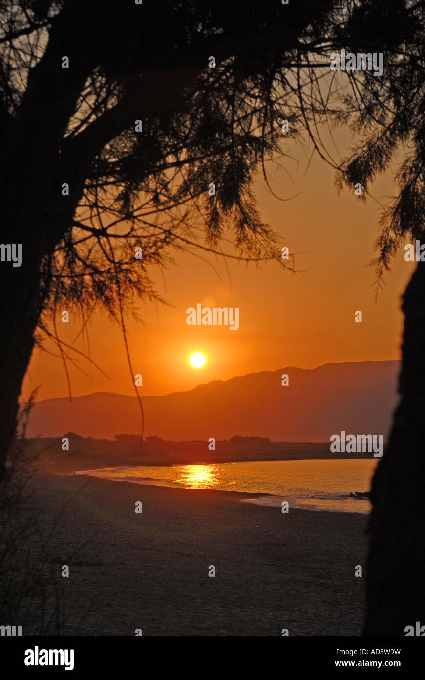 CRETE Sunset over the Rodhopou Peninsula seen from the beach at Maleme ...