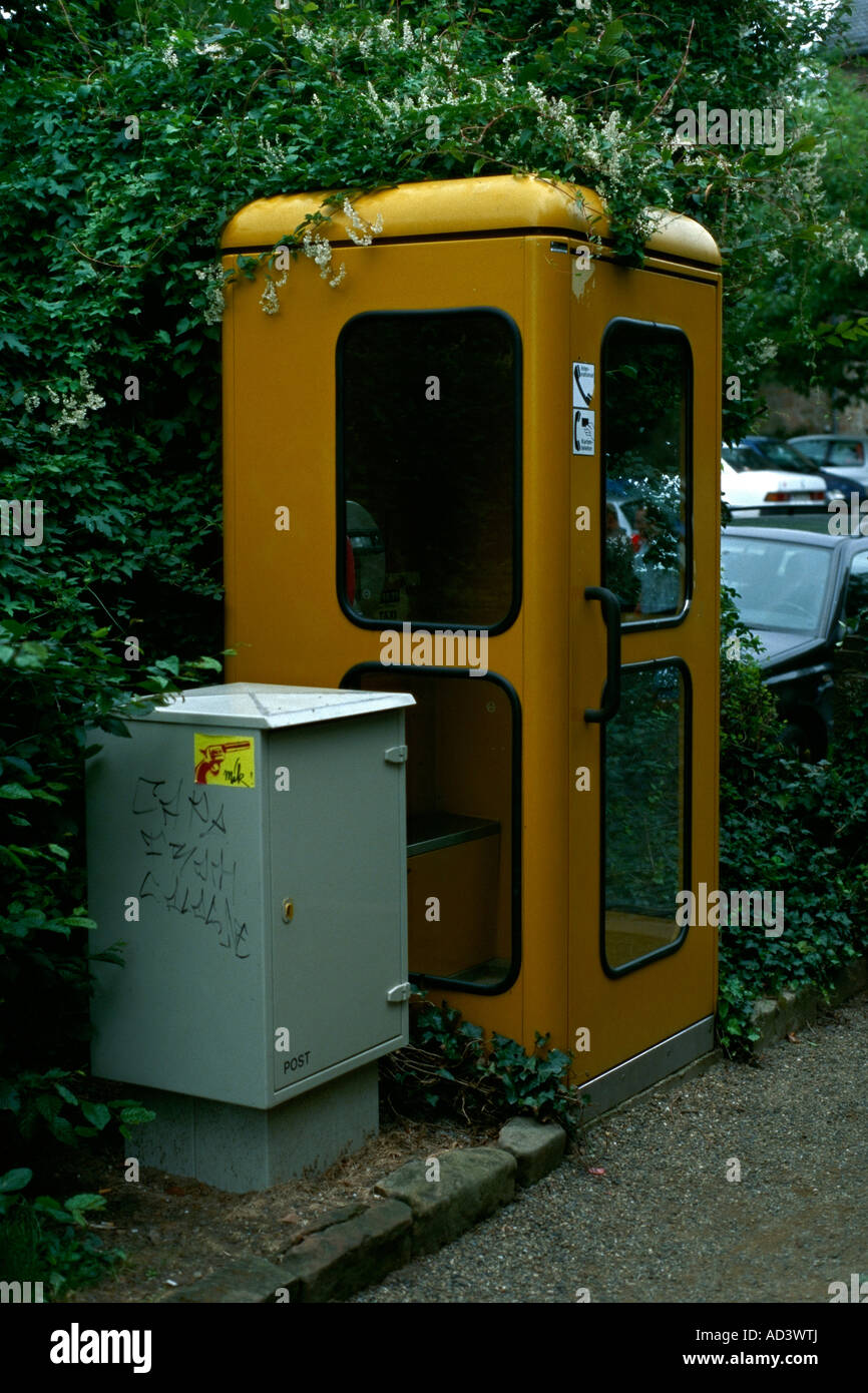 Eighties style telephone booth in Germany Stock Photo - Alamy