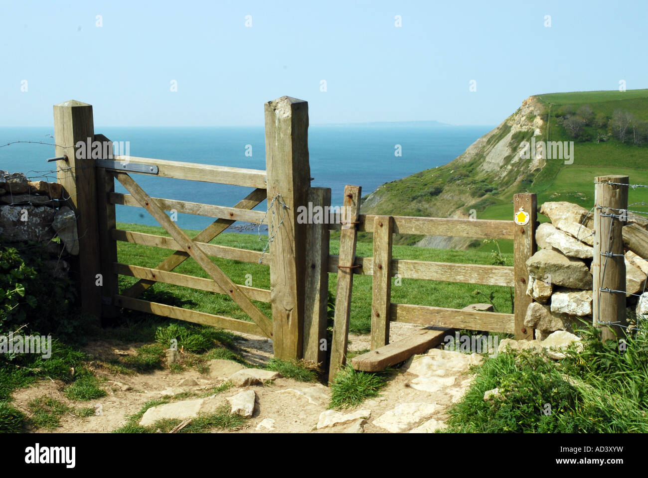 A gate and style on the Dorset Coast Path Stock Photo - Alamy