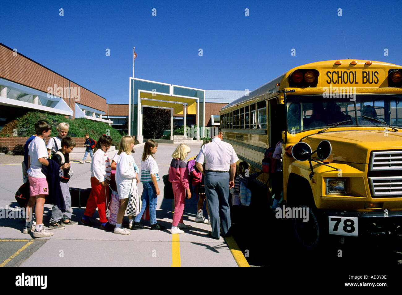 Children boarding a bus outside of an elementary school in Boise Idaho ...