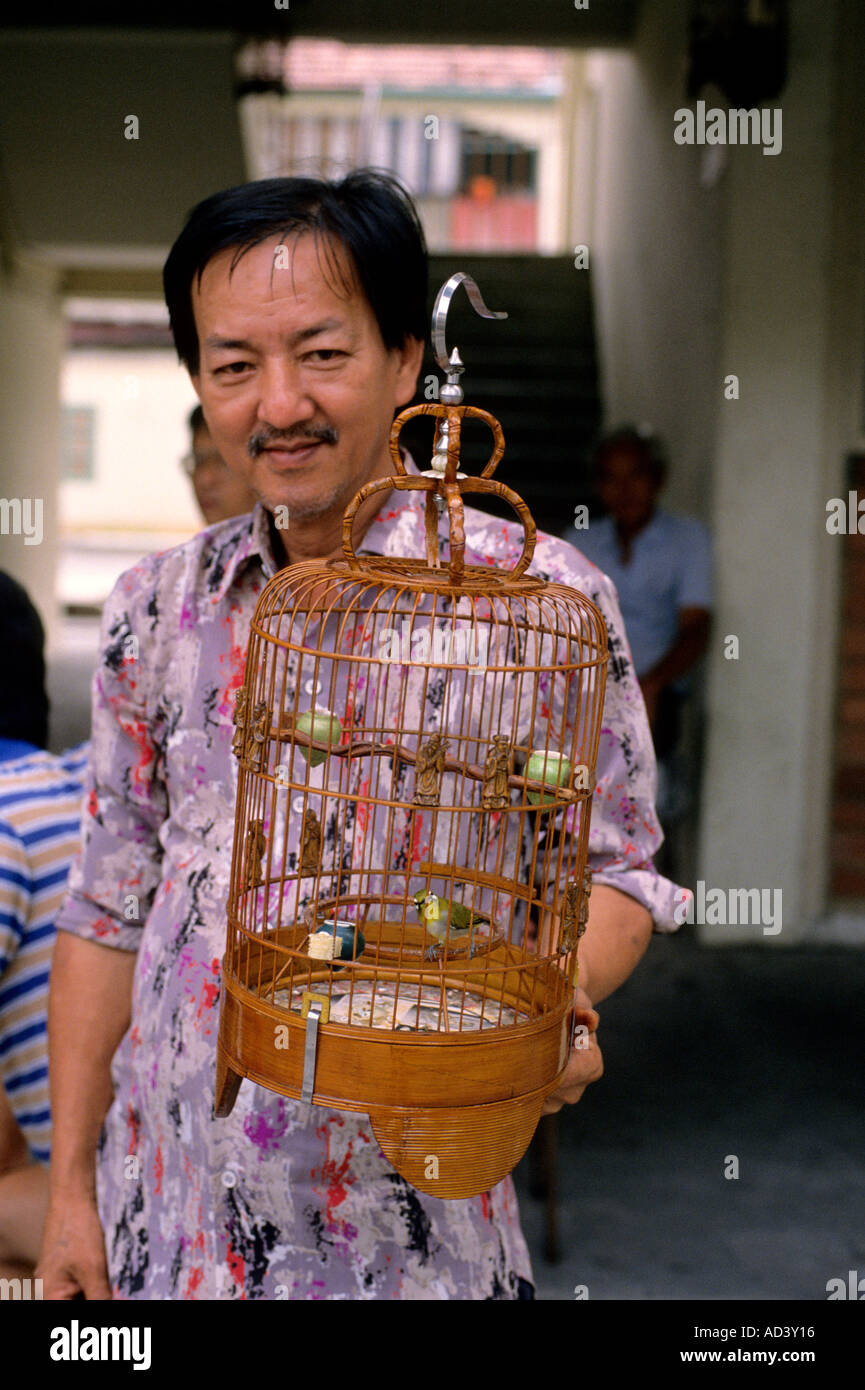 Chinese man with a bird cage hi-res stock photography and images - Alamy