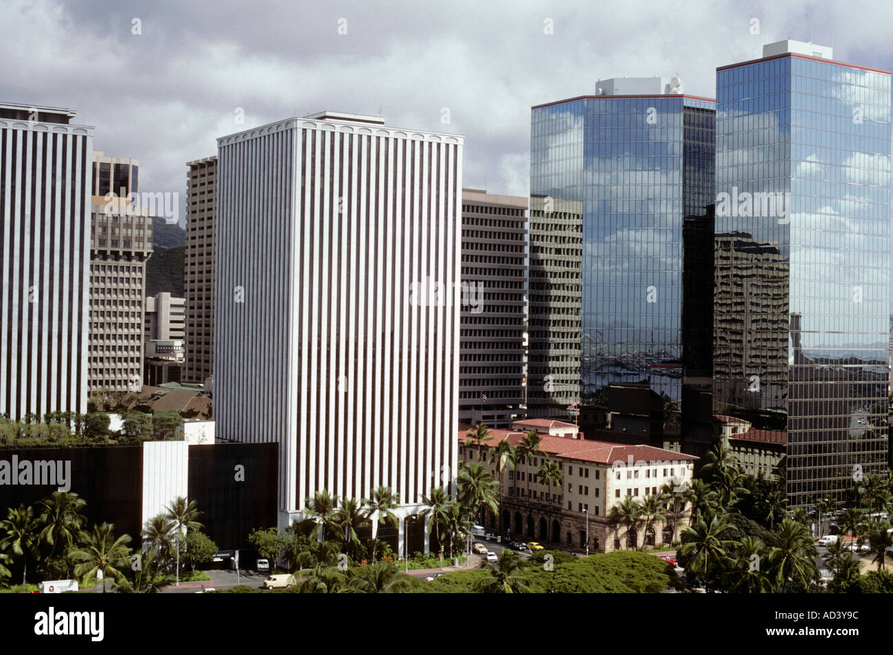 Steel and glass skyscrapers rise above smaller older buildings in ...