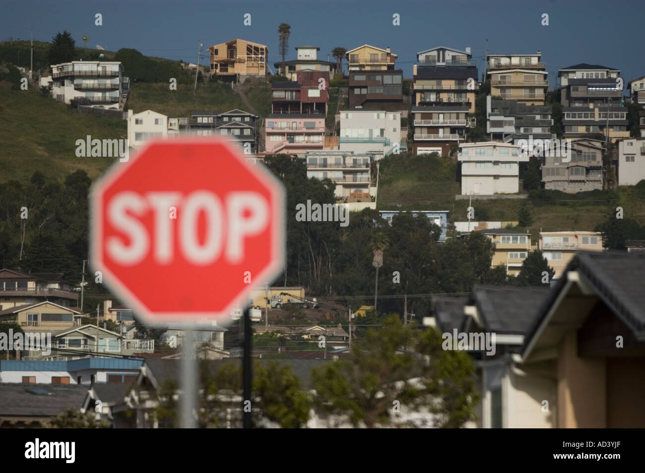 Stop sign at intersection Stock Photo - Alamy