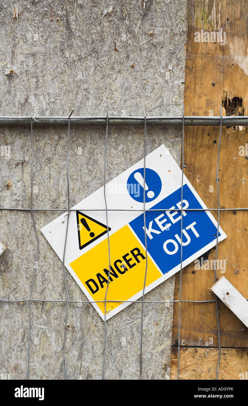 A Danger/Keep Out Sign is fixed to a piece of chipboard wood at an ...