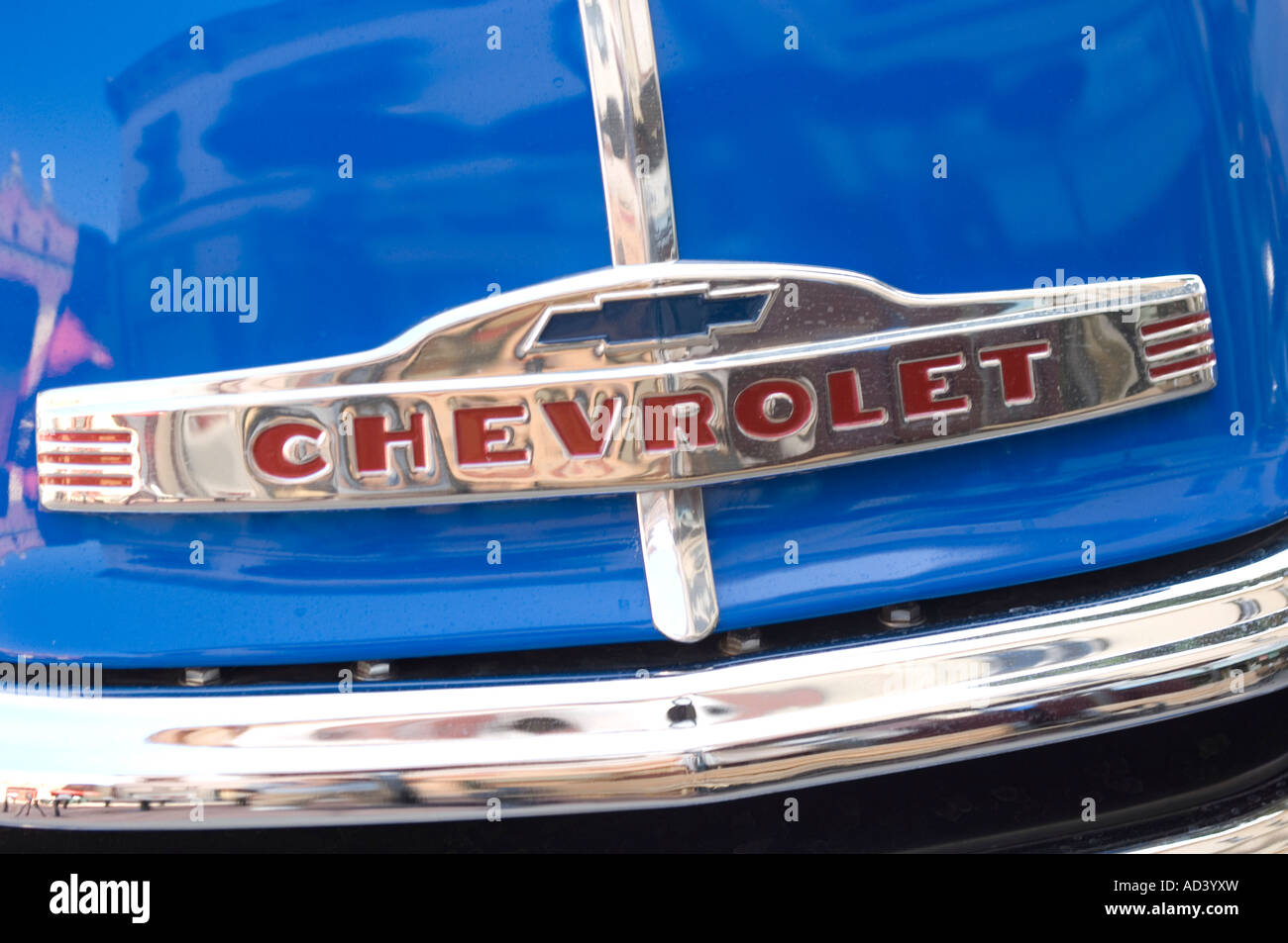 Blue Truck: Abstract closeup of the emblem on a classic chrome and blue ...