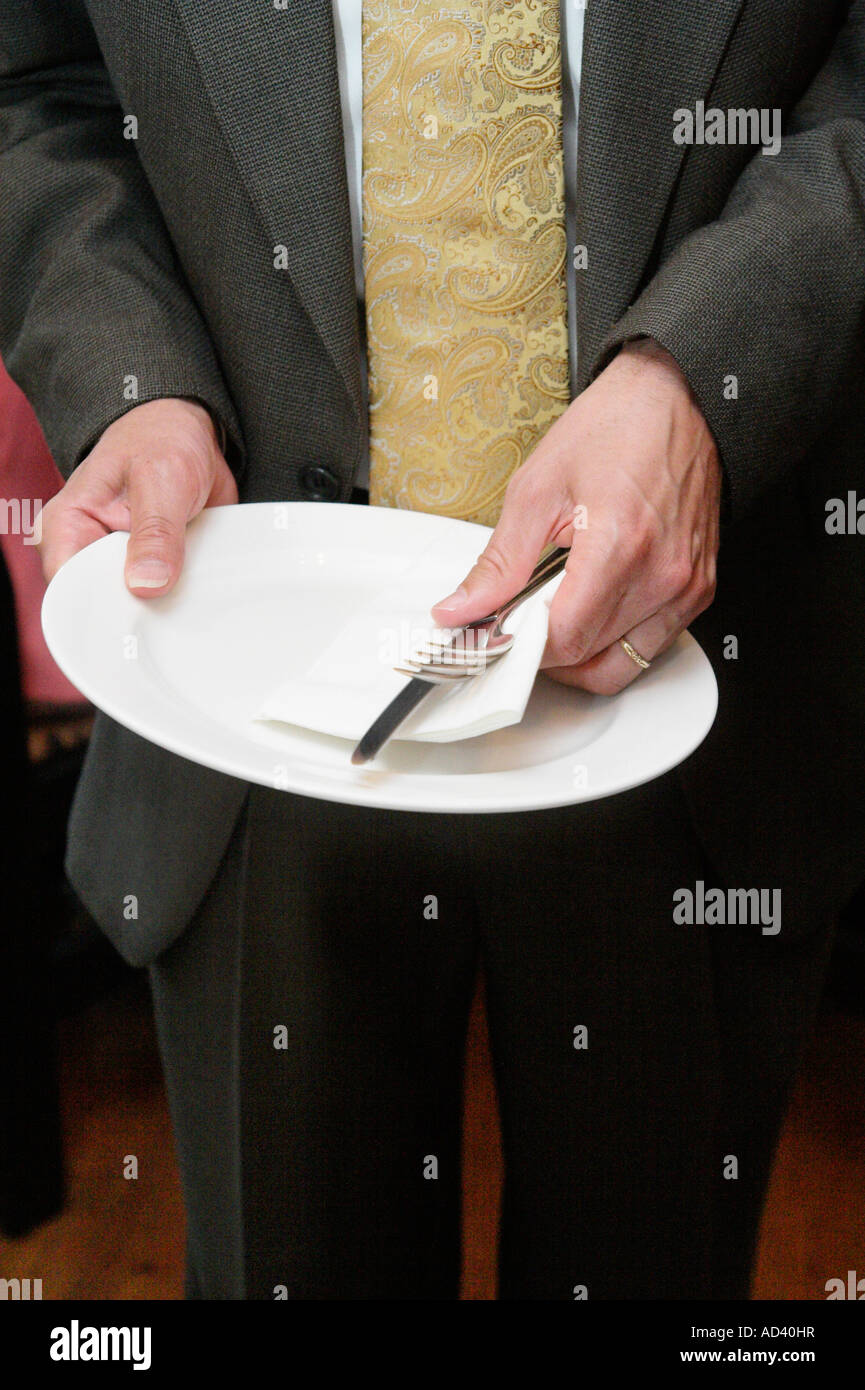 Man holding food plate buffet hi-res stock photography and images - Alamy