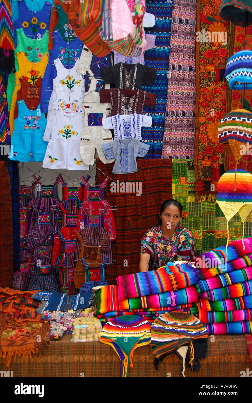 Indigenous woman selling traditional Mayan textiles on Chichicastenango ...
