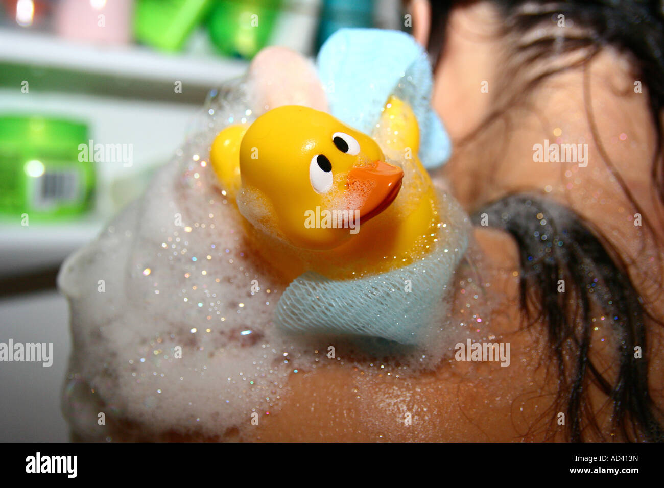 Woman using a bath sponge Stock Photo - Alamy
