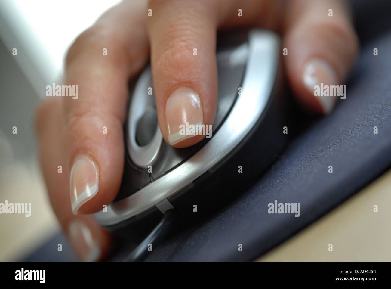 Womans hand using a computer mouse with scroll wheel in an office Stock ...