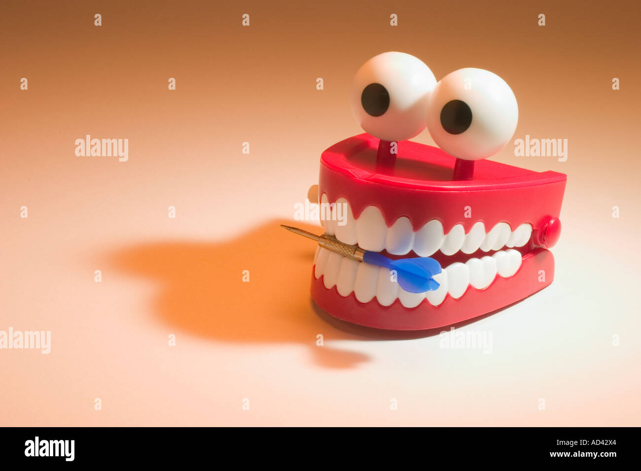 Chattering Teeth Toy with Dart Stock Photo - Alamy