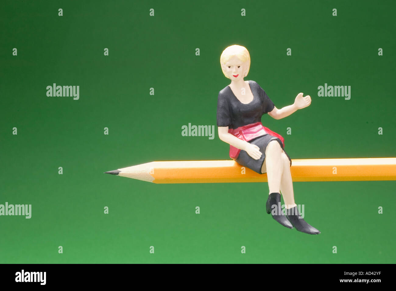 Miniature Female Figure on Pencil Stock Photo - Alamy