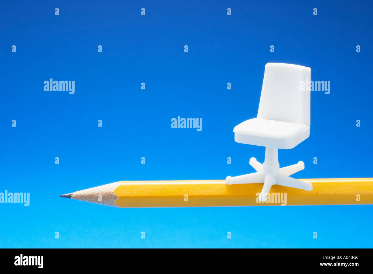 Miniature Executive Chair on Pencil Stock Photo - Alamy