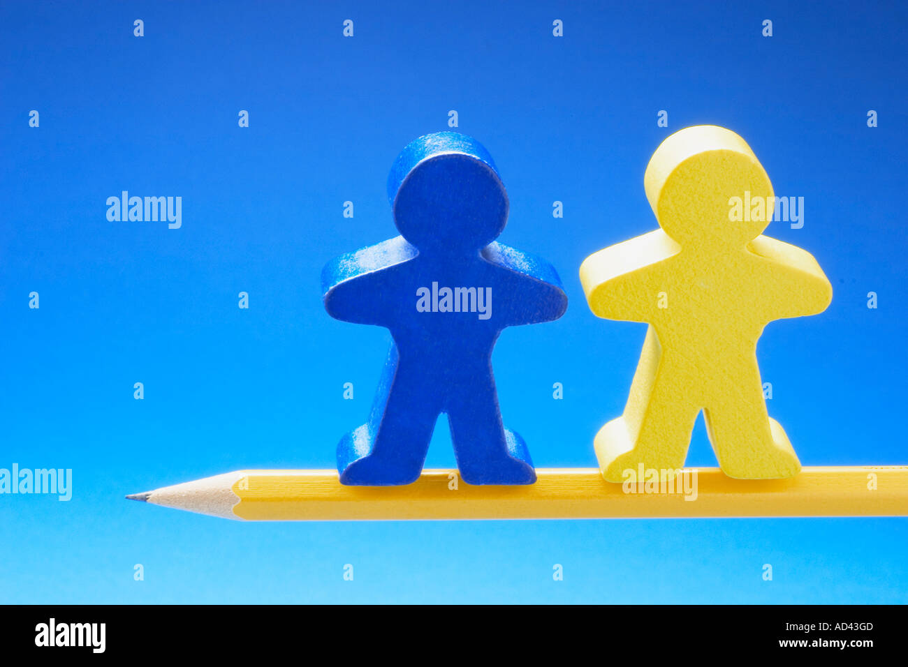 Wooden Children Figures Standing on Pencil Stock Photo - Alamy