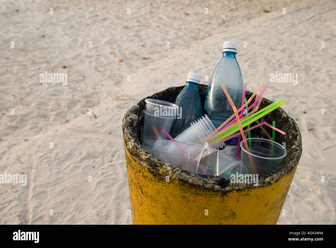 Bin trash can on beach Stock Photo - Alamy