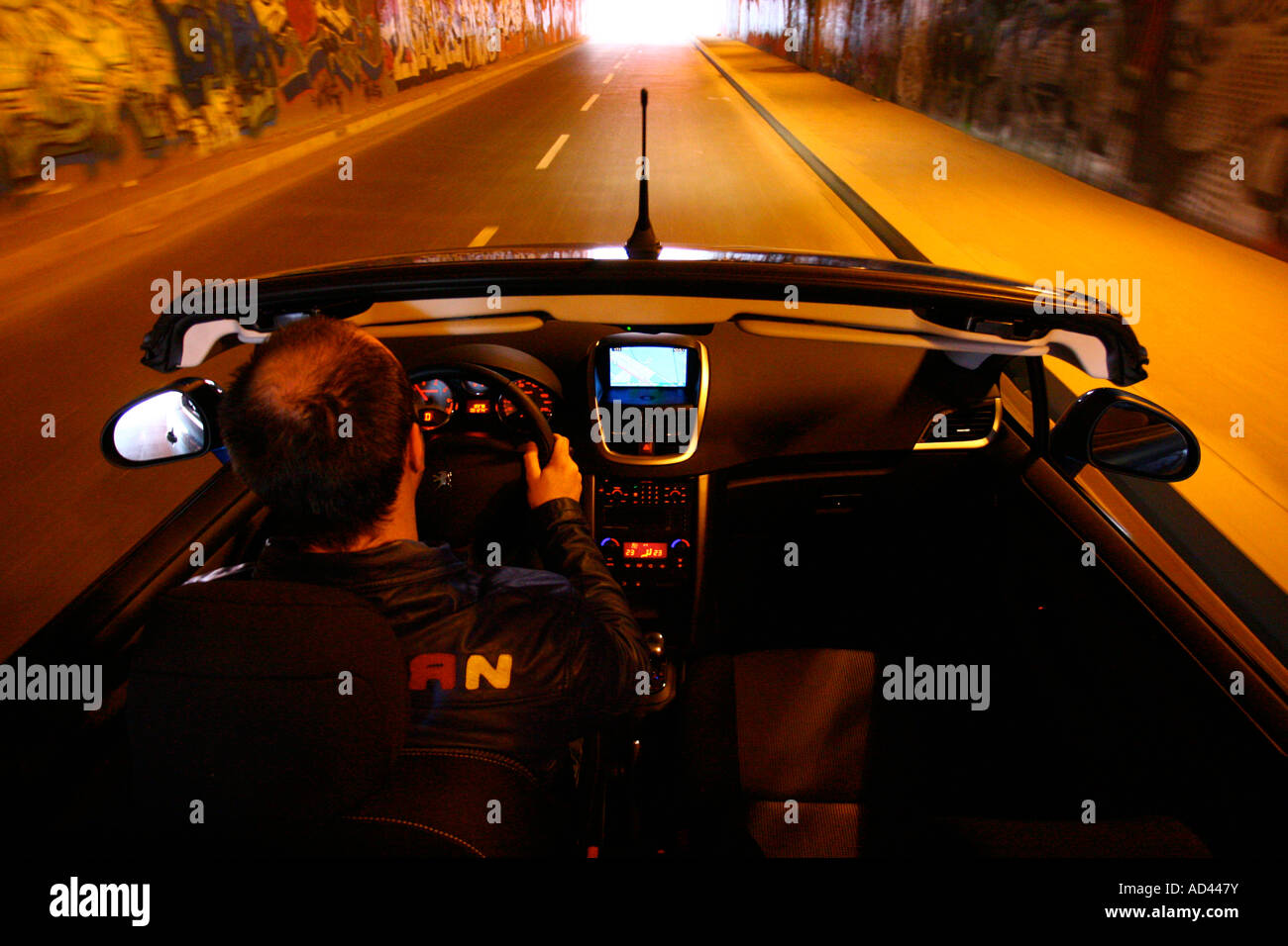 man drive in a gallery Stock Photo - Alamy