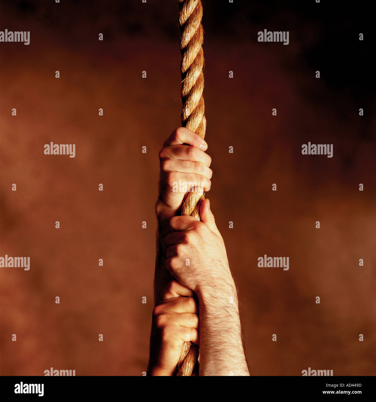 Hands on rope Stock Photo - Alamy