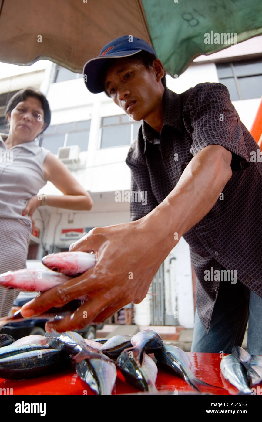 vendor selling fish at manado market Stock Photo - Alamy