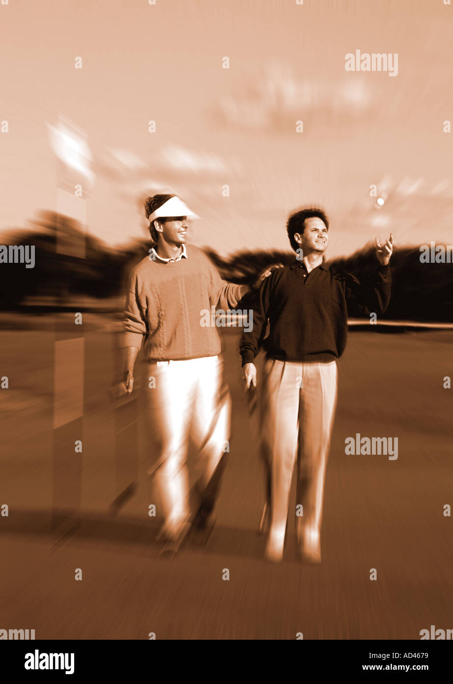 Two men playing golf together Stock Photo - Alamy