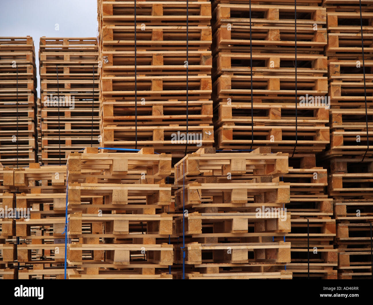 Piled wooden pallets Stock Photo - Alamy