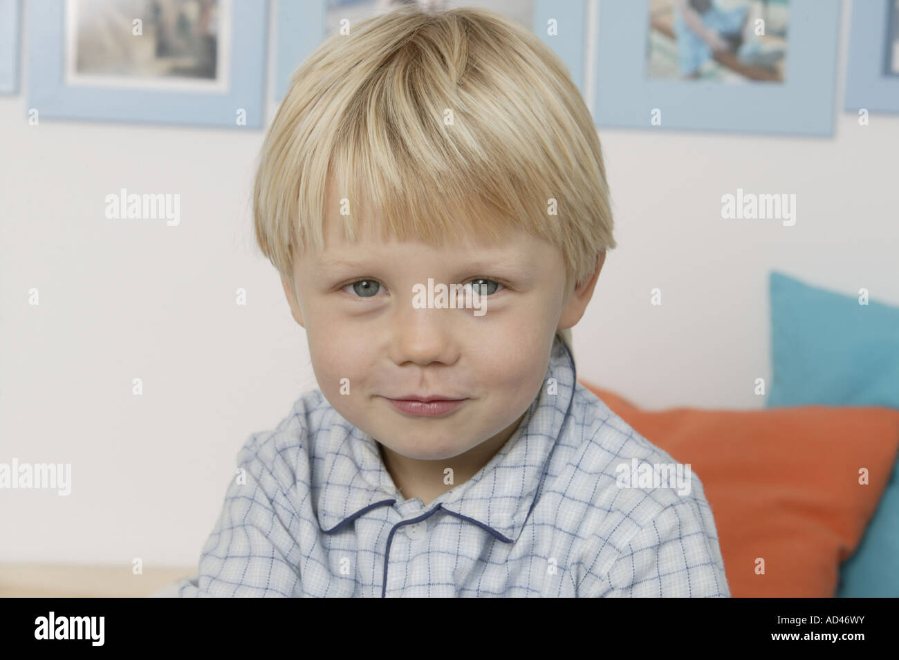 Little boy in pyjamas, sitting in bed Stock Photo - Alamy